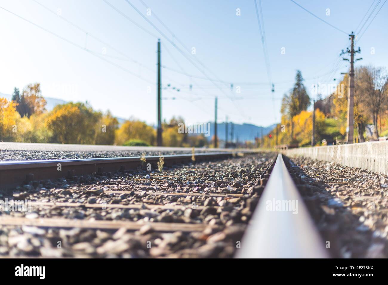 Sustainable traveling by train: Rail track and colorful, idyllic ...