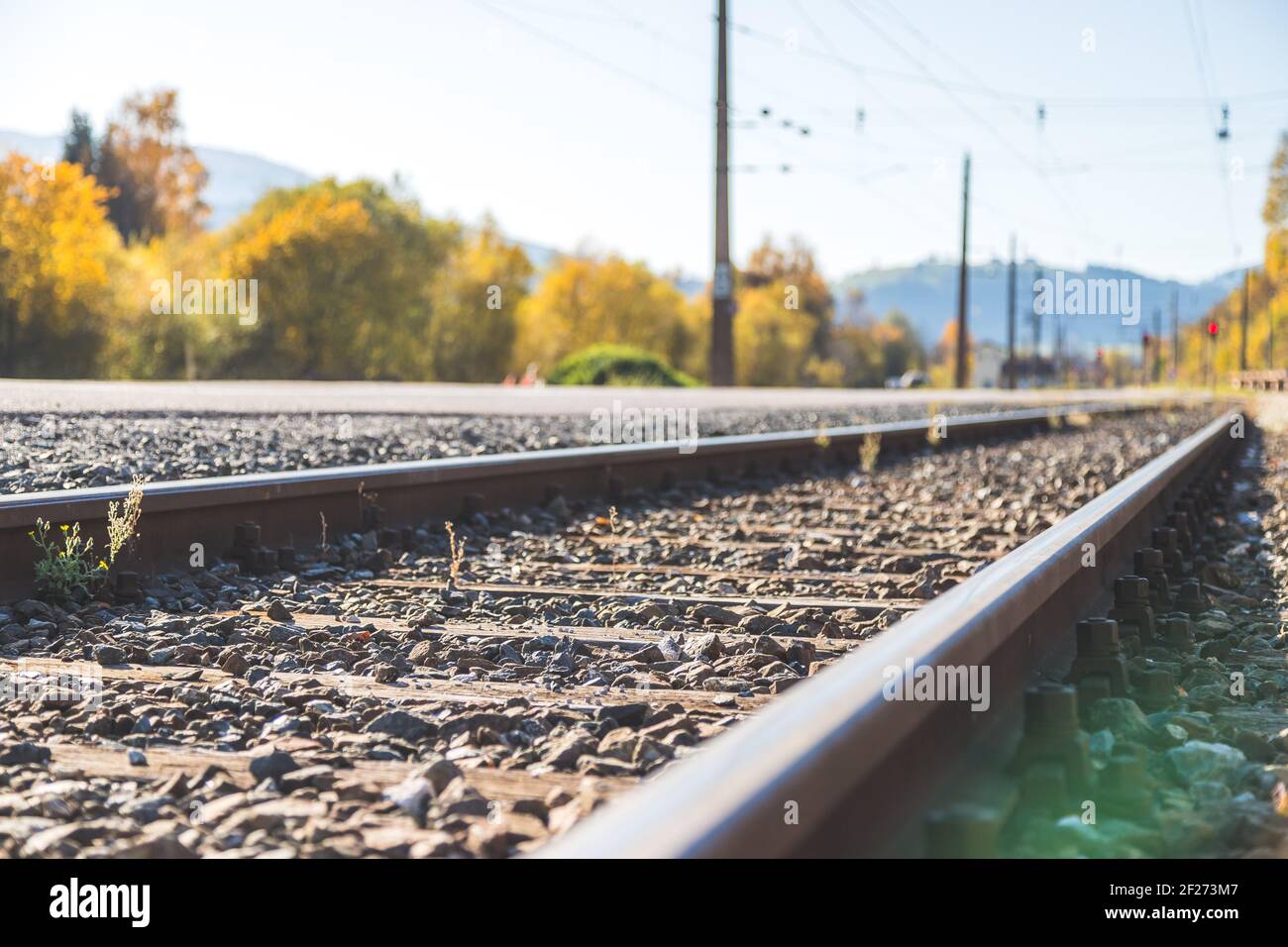 Sustainable traveling by train: Rail track and colorful, idyllic ...