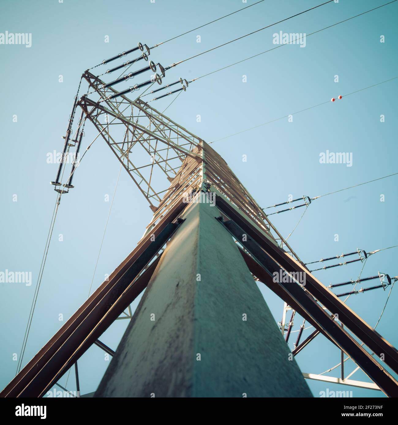 Close up of electrical tower and blue sky. Renewable energy and smart ...