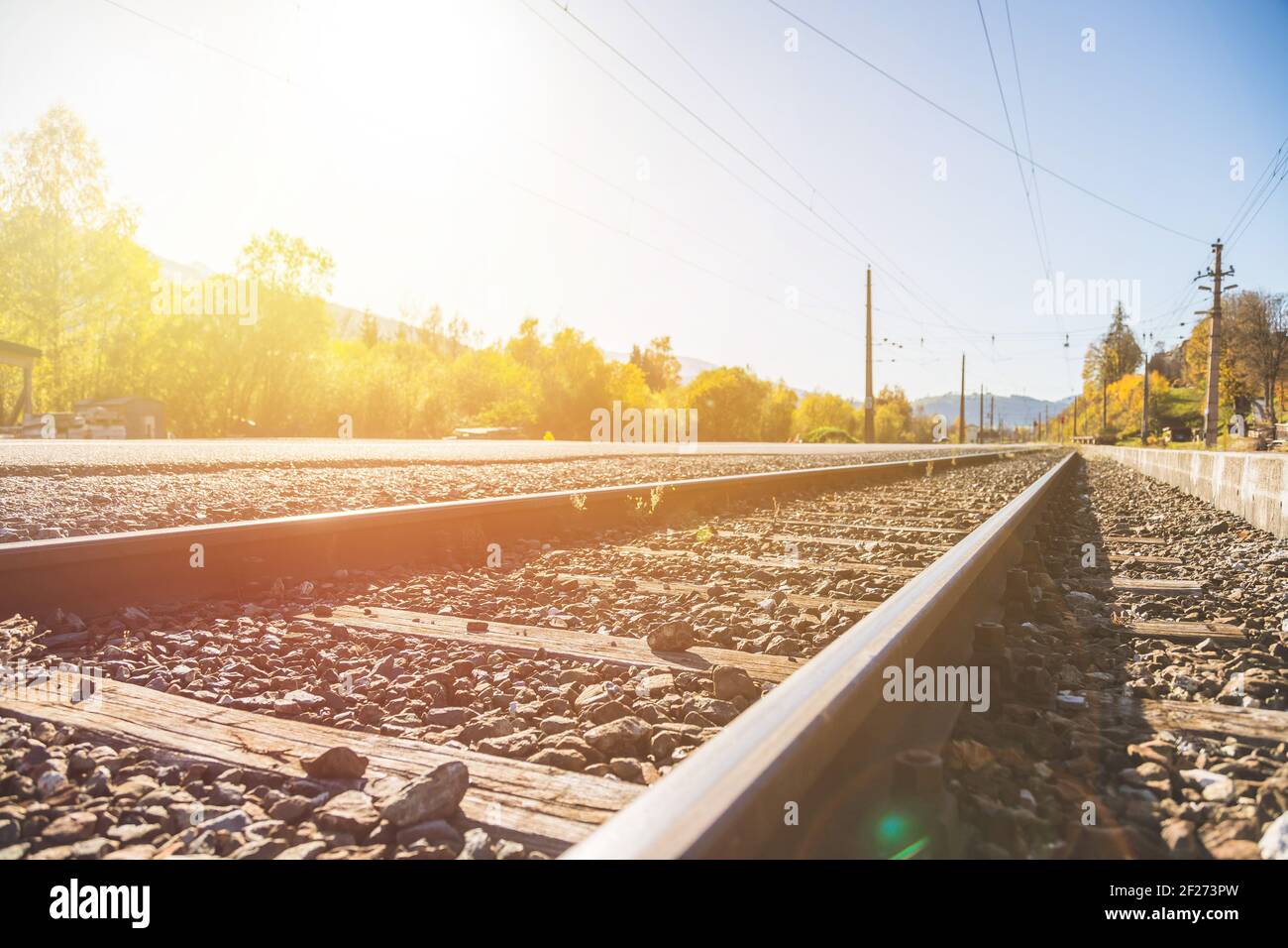 Sustainable traveling by train: Rail track and colorful, idyllic ...