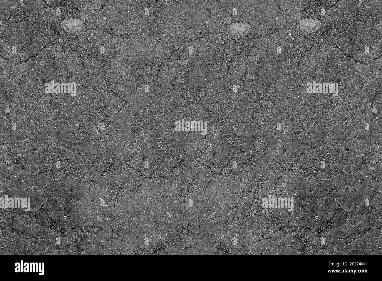 A closeup shot of a rough gray grain surface with cracks on it Stock ...