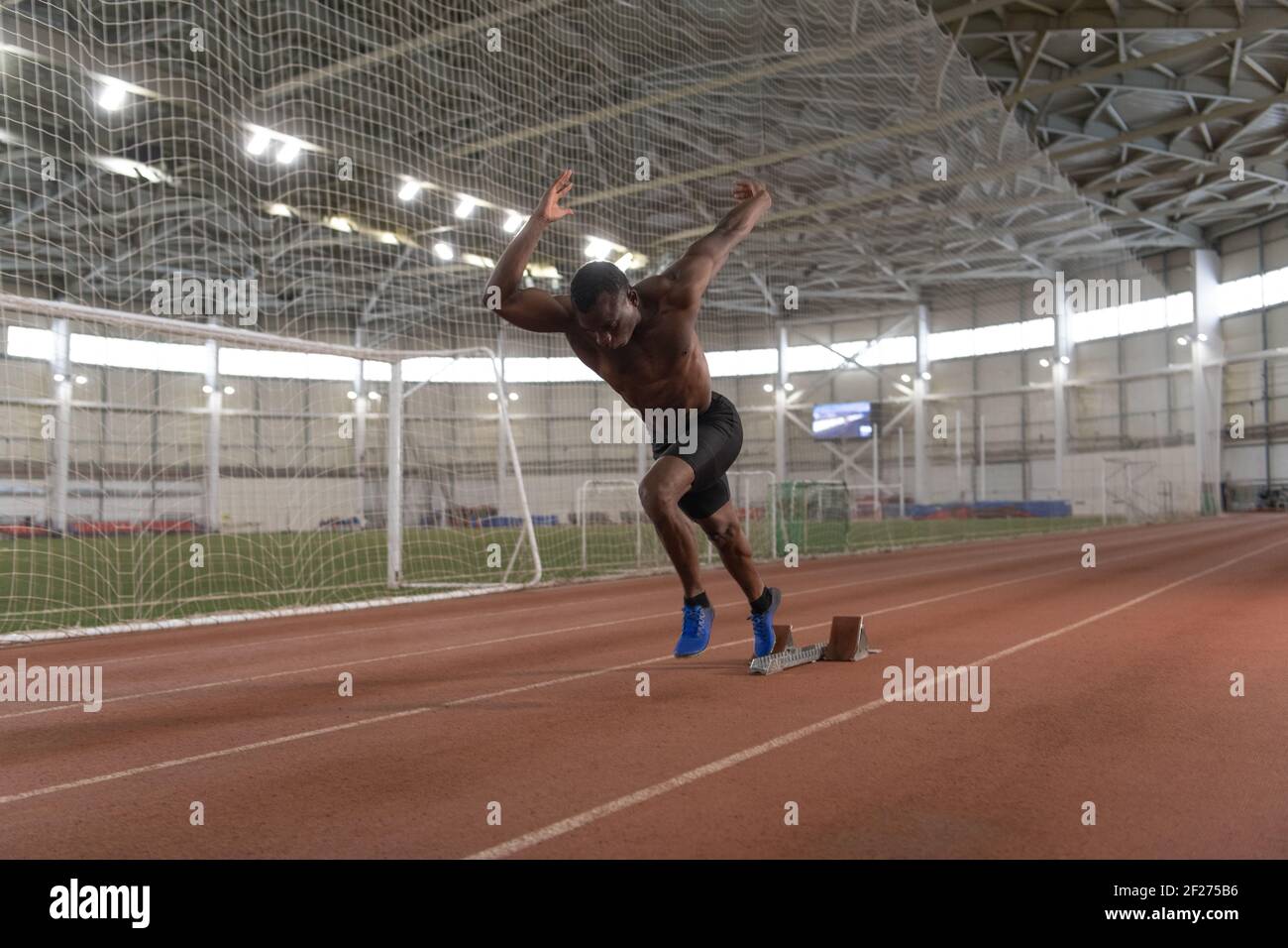 Fast African American athlete running on track Stock Photo - Alamy