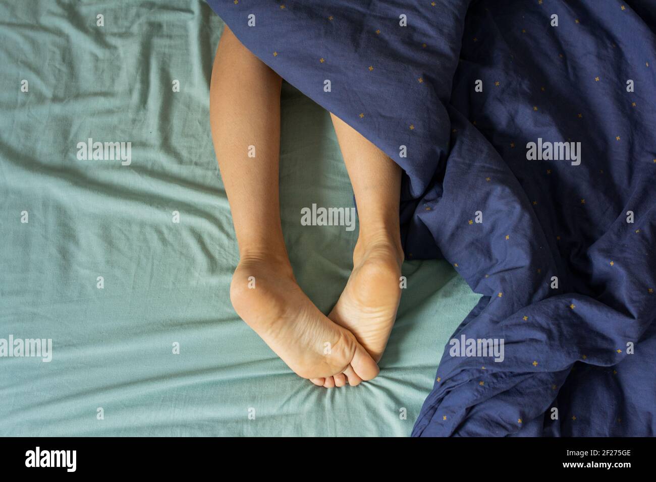 Crossed toes hi-res stock photography and images - Alamy