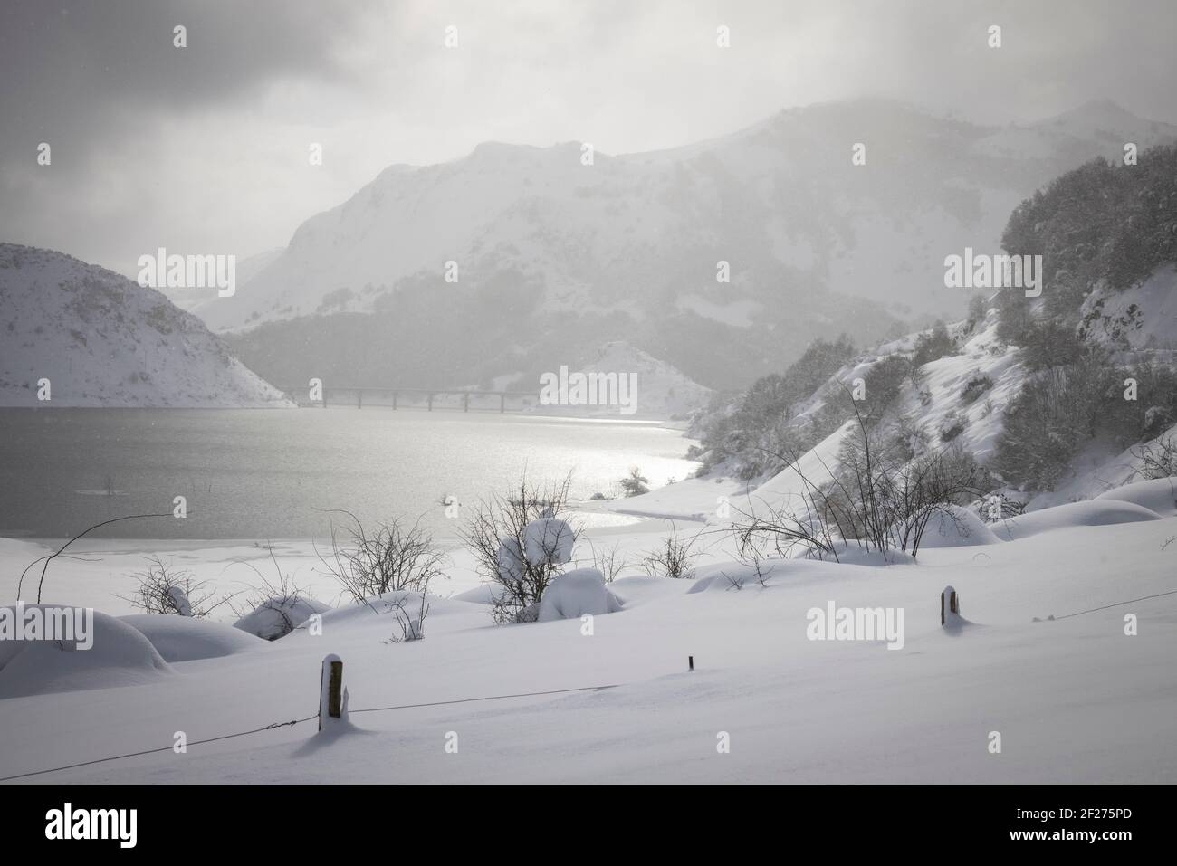 sunset in full reservoir in snow storm Stock Photo - Alamy