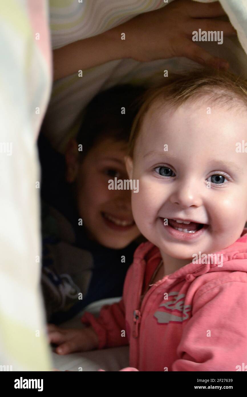 close up picture of baby girl with her brother behind her back Stock ...