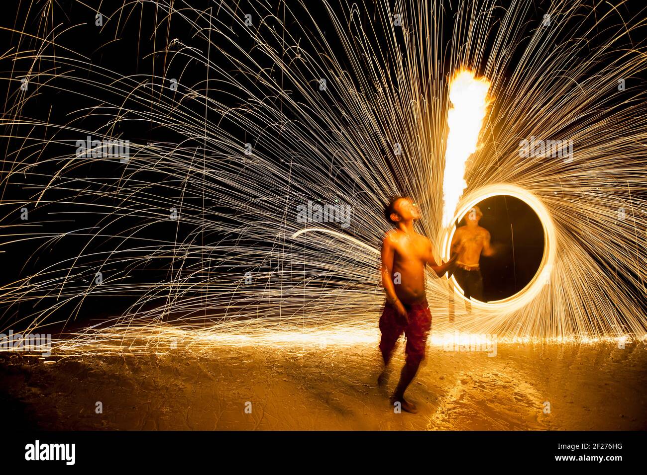 Fire dancer performing on the beach in Railay Stock Photo - Alamy
