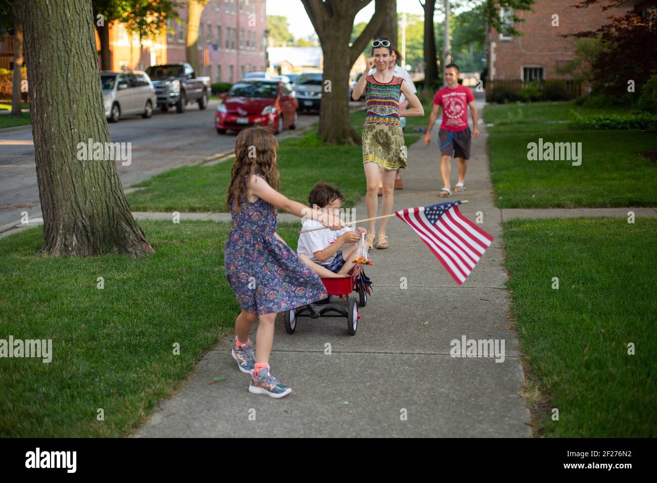 Kids on flag day parade american flag hi-res stock photography and ...