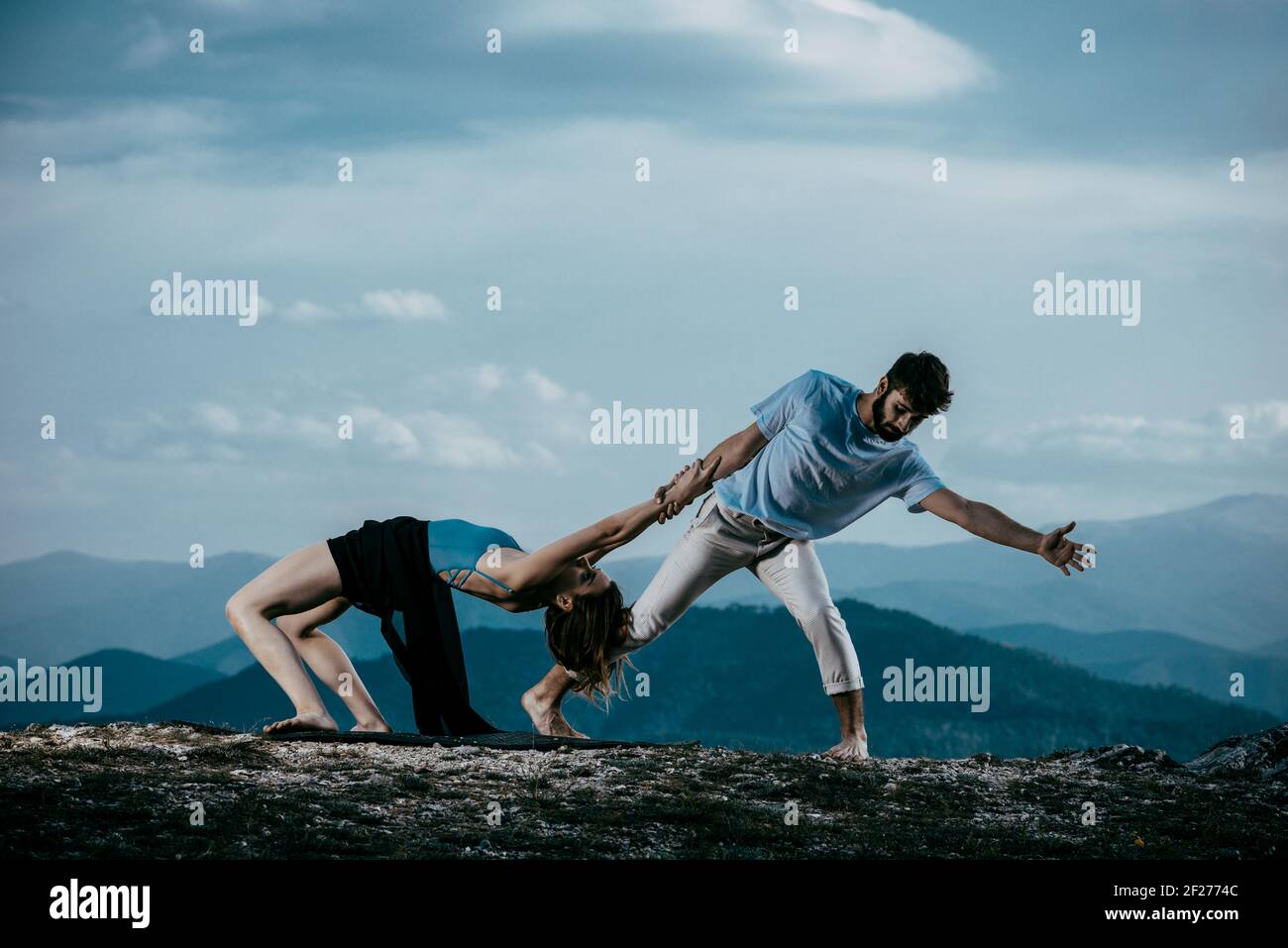 Skillful hip-hop dancers in movement. Young couple of modern dance ...