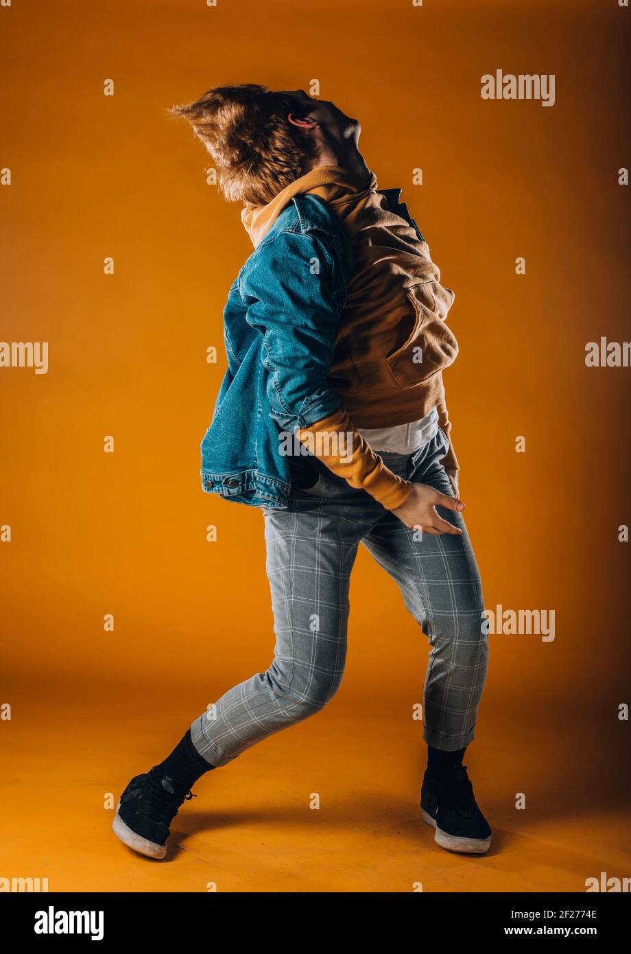 Muscular young guy practicing modern style dance poses Stock Photo - Alamy