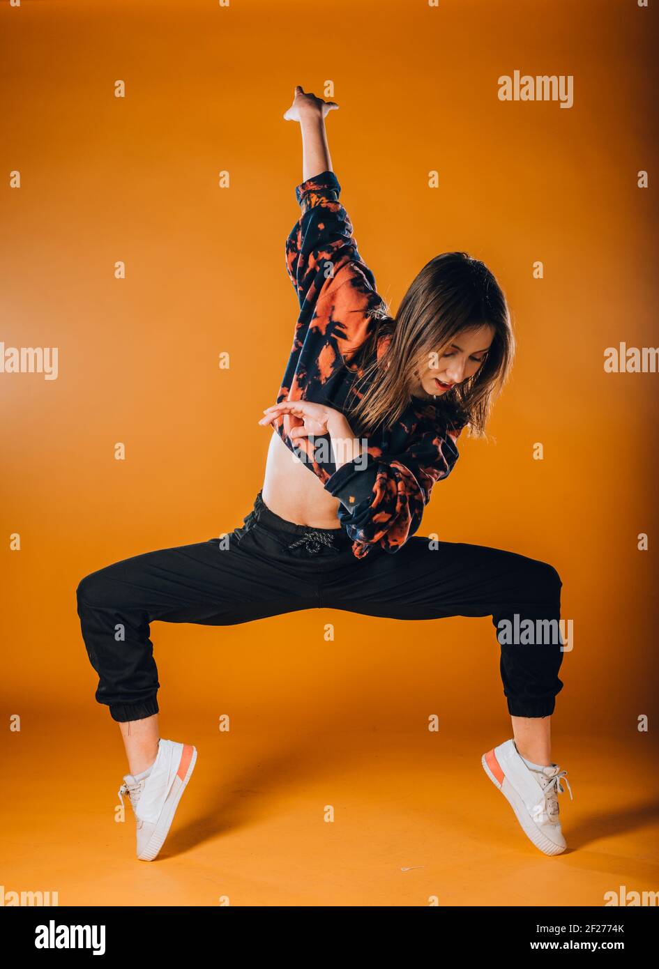 Stylish young girl performing an artistic dance choreography Stock ...