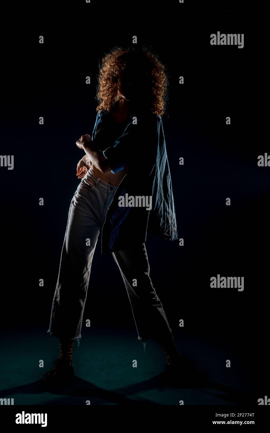 Slender flexible dance performer during a dance practice in modern ...