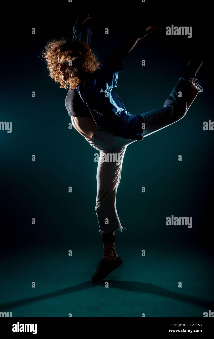 Athletic dancer performing an element of dance gymnastics Stock Photo ...