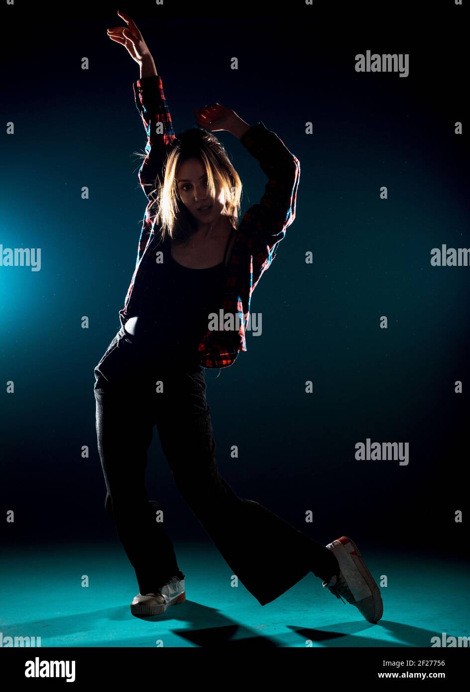 Artistic modern dancer practicing dancing moves in the studio Stock ...