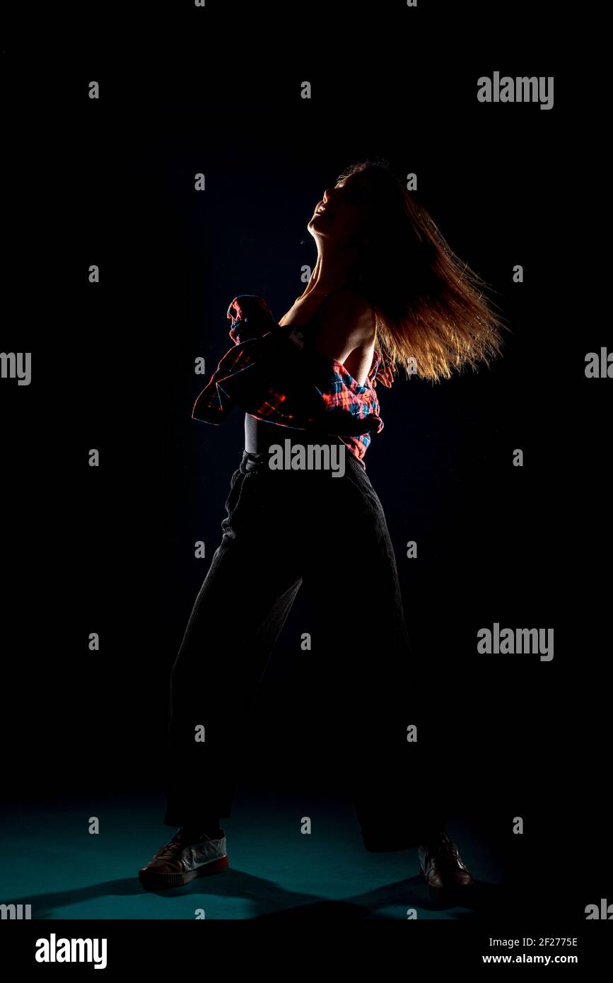 Slender flexible dance performer during a dance practice in modern ...