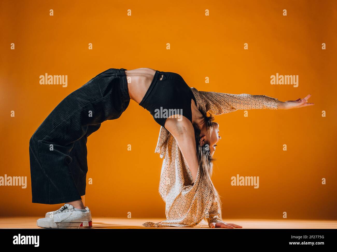 Athletic dancer performing an element of dance gymnastics Stock Photo ...