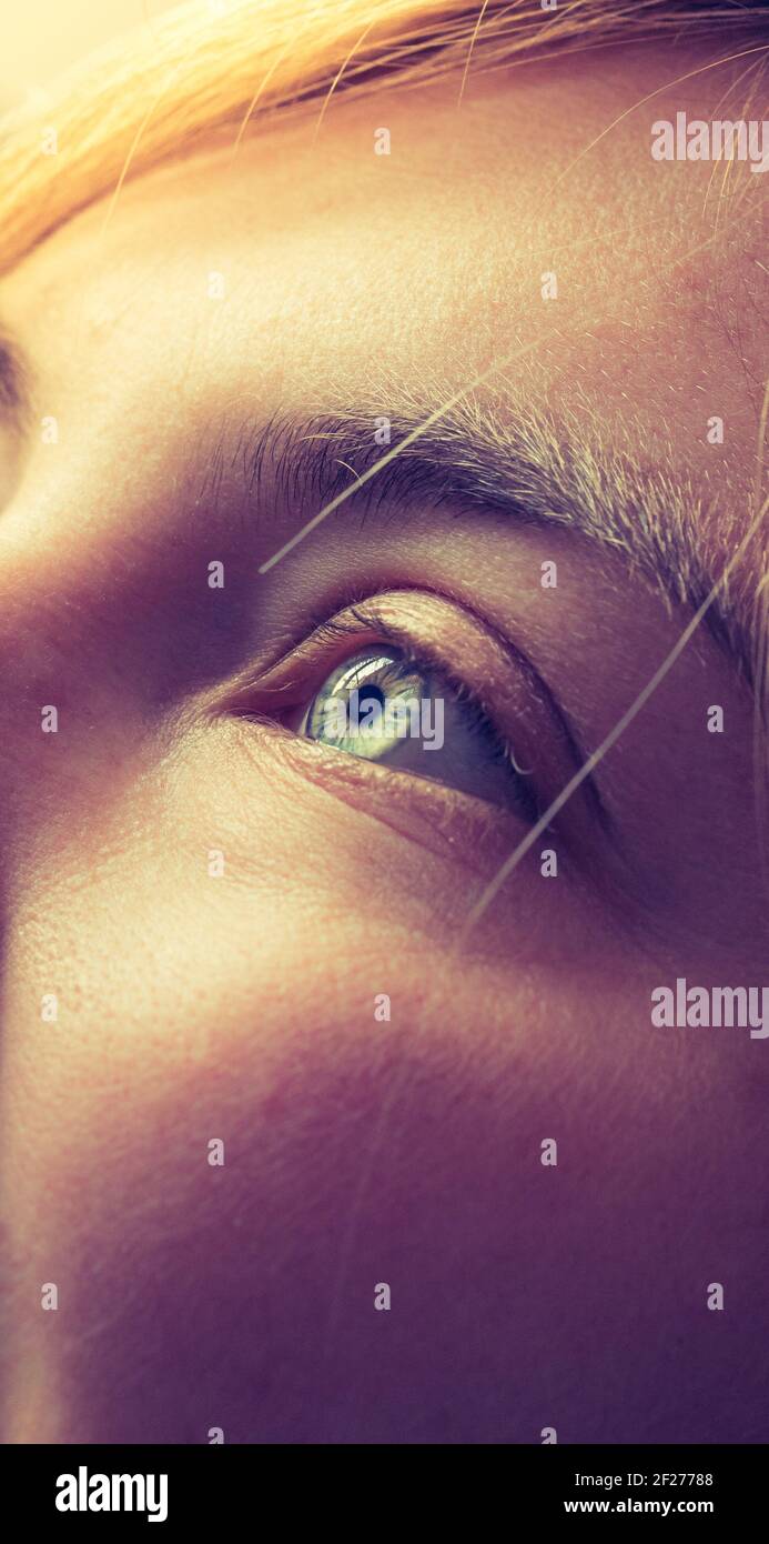 Close up of feminine natural blue eyes, cut out of the face, healthcare ...