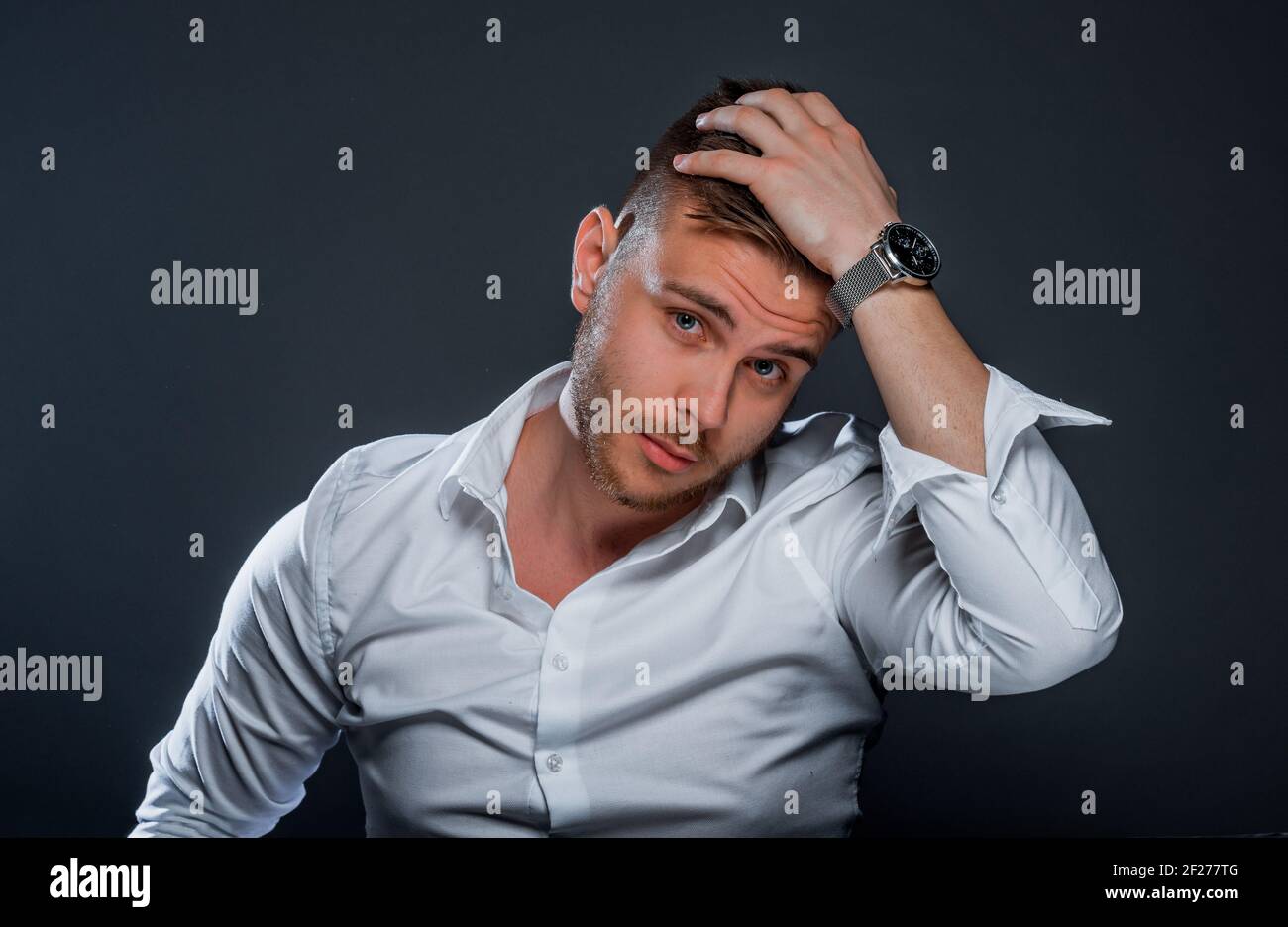 Studio body shot of a trendy young man wearing modern style clothes ...
