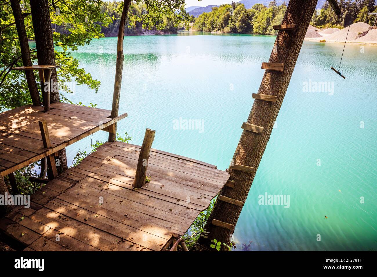 Wooden platform and a beautiful blue lake, playground Stock Photo - Alamy