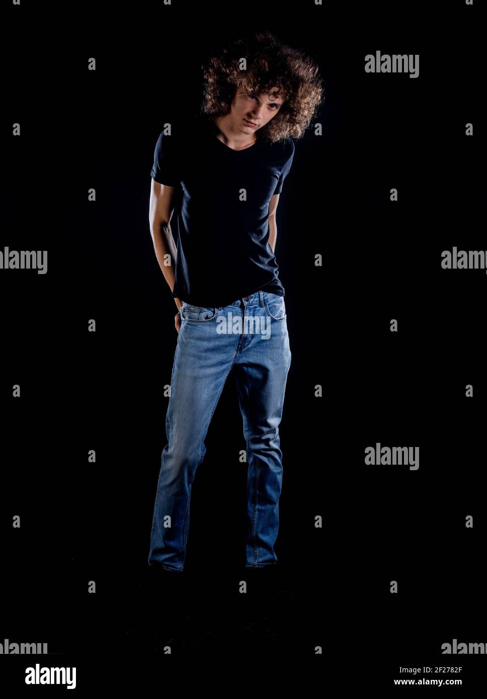 Studio body shot of a trendy young man wearing modern style clothes ...