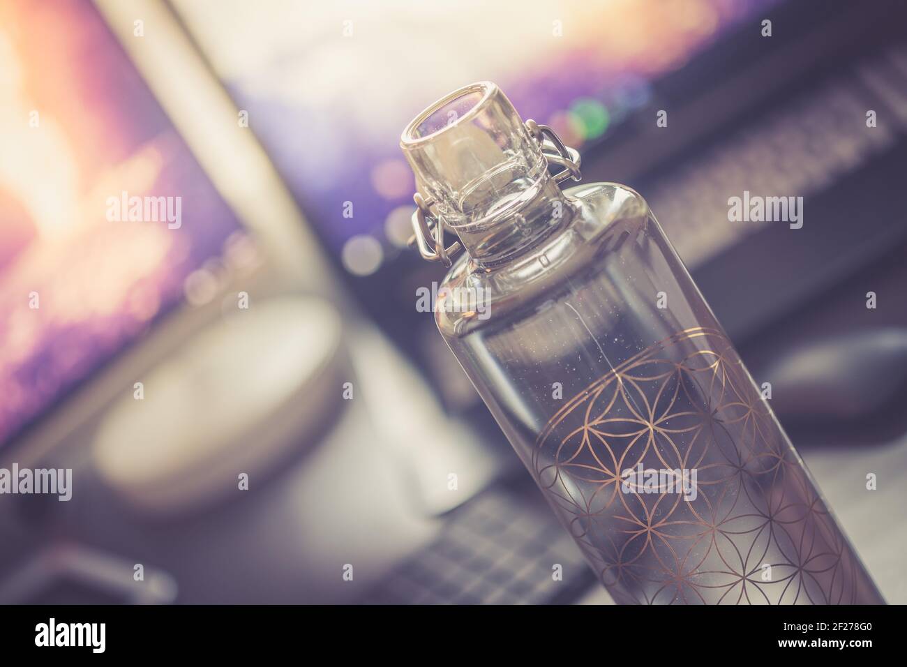 Drinking water in the office: close up of glass bottle, workplace Stock ...