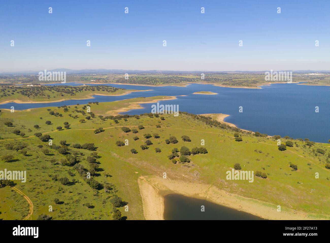 Dam lake reservoir drone aerial view of Barragem do Caia Dam olive ...