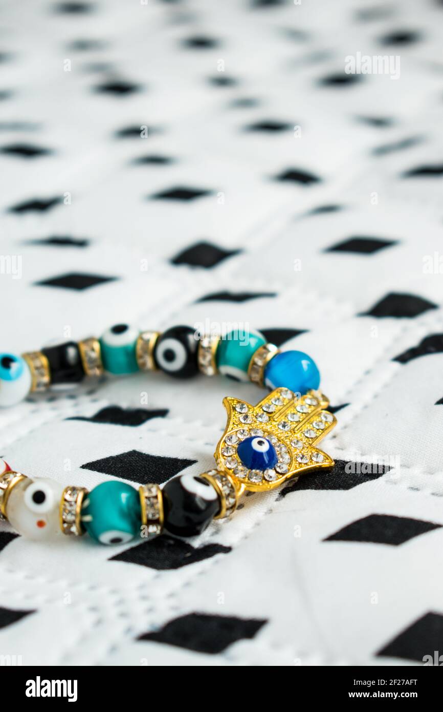 Asian golden protector symbol in a colorful craft on a white, big and ...