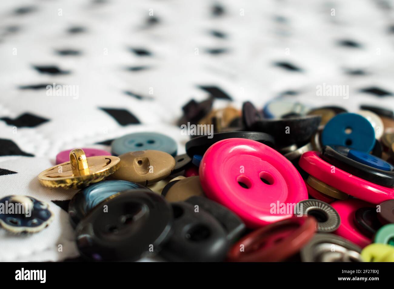 Some different colorful buttons on white, big and soft surface with ...