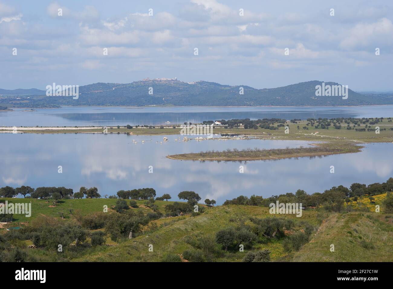 Lake reservoir water reflection of Alqueva Dam landscape and Monsaraz ...