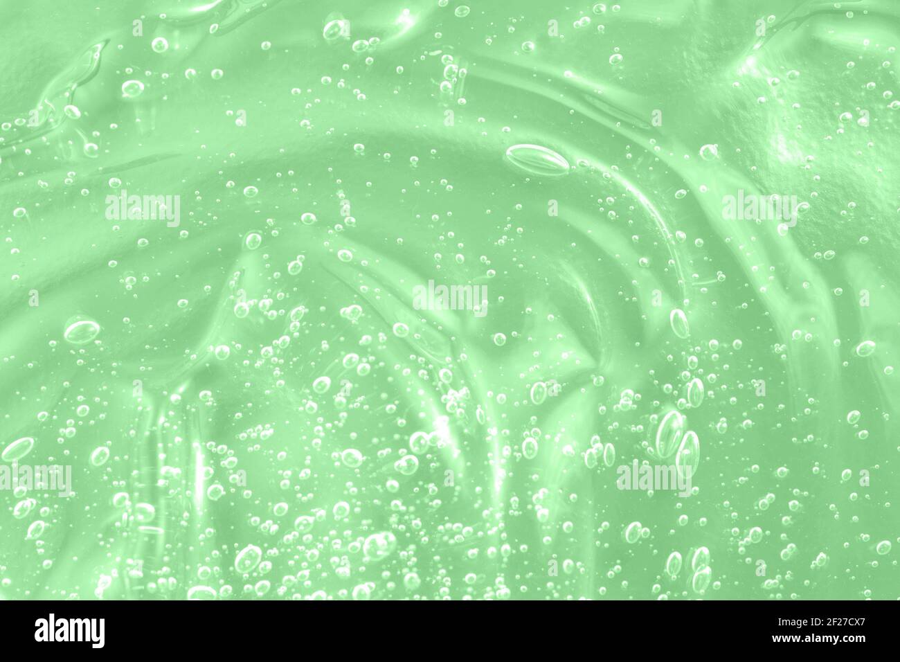 Hyaluronic acid clear serum sample. Aloe vera cosmetic gel texture with ...