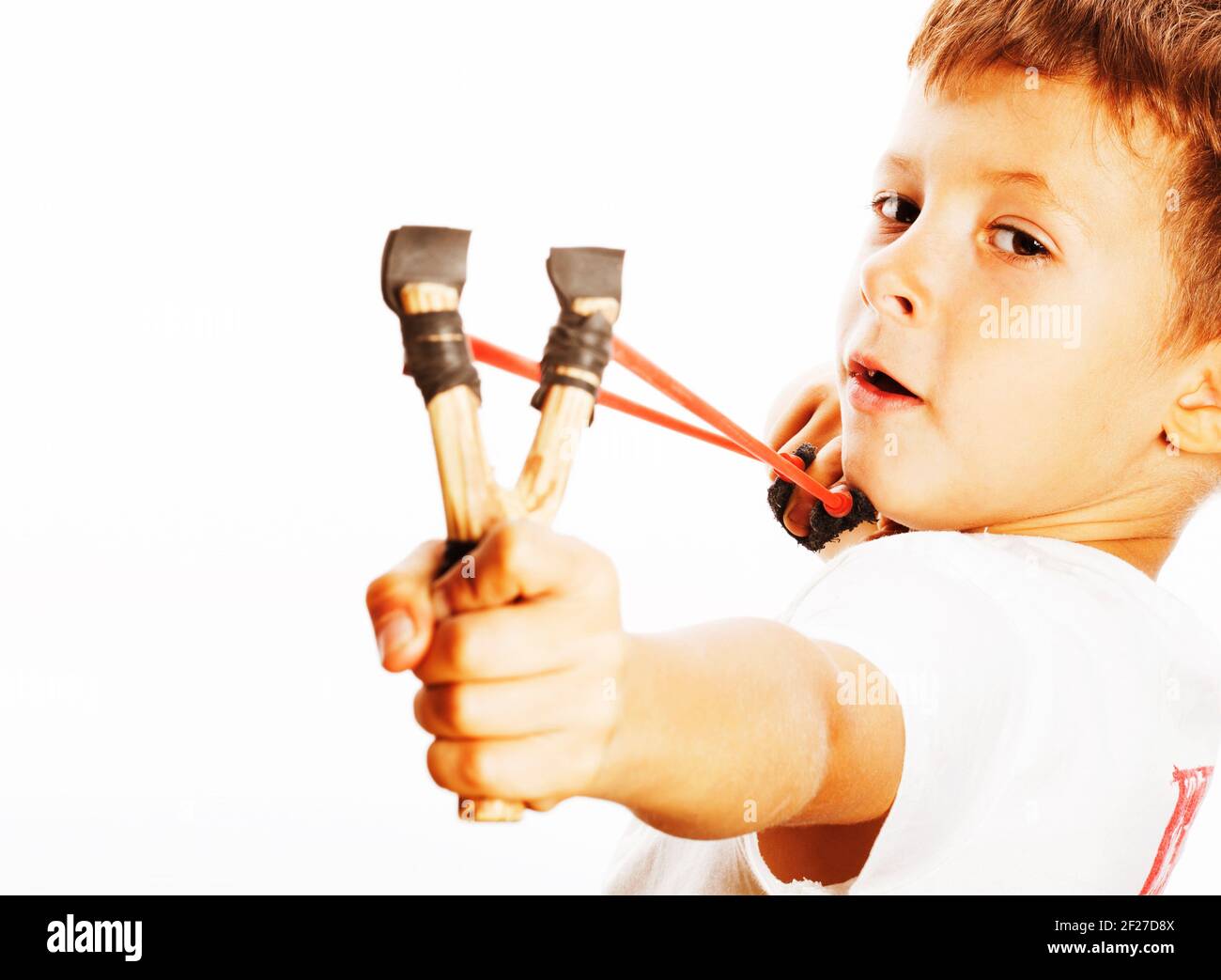 little cute angry real boy with slingshot isolated Stock Photo - Alamy