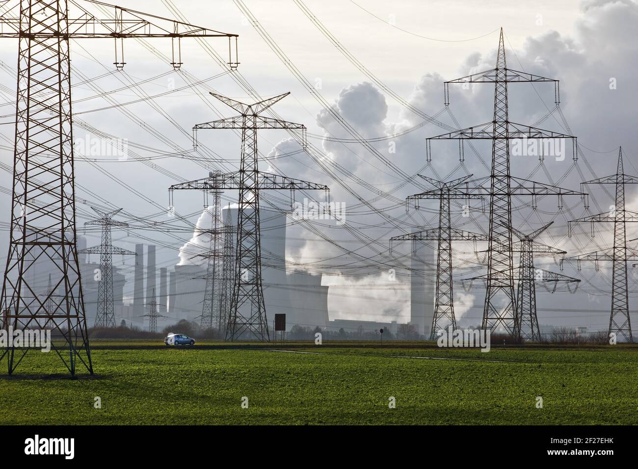 High-voltage pylons in front of the Neurath lignite power station ...