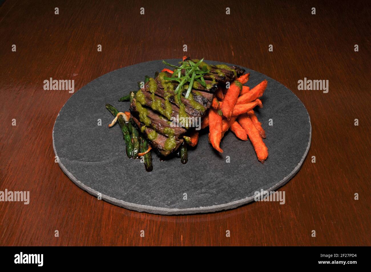 Delicious steak with mint mojo ready to be eaten Stock Photo - Alamy