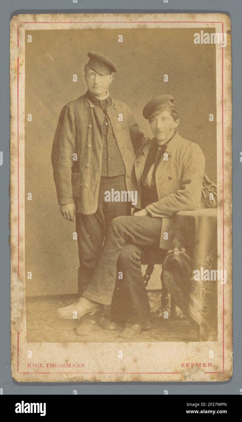 Portrait two men at table Stock Photo - Alamy