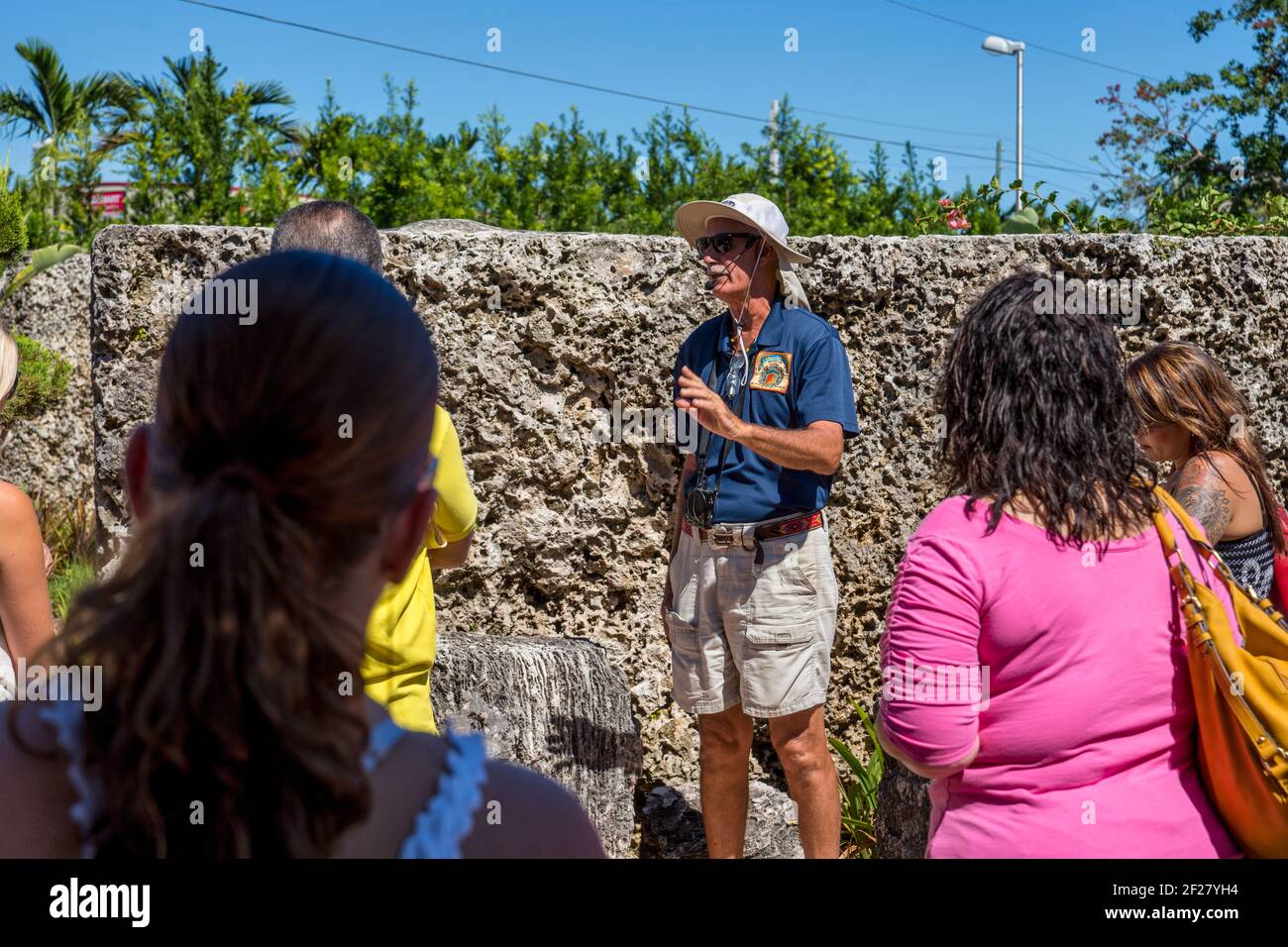 A tour guide addresses a group inside the Coral Castle located south of ...