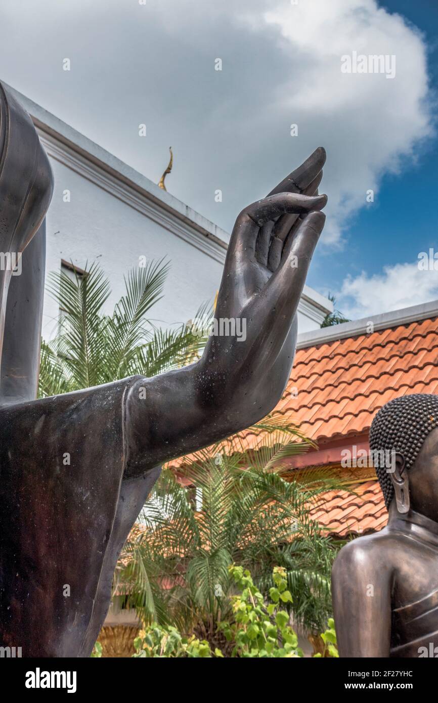 The out stretched hand of a Leela attitude Buddha over the Forest Monk ...