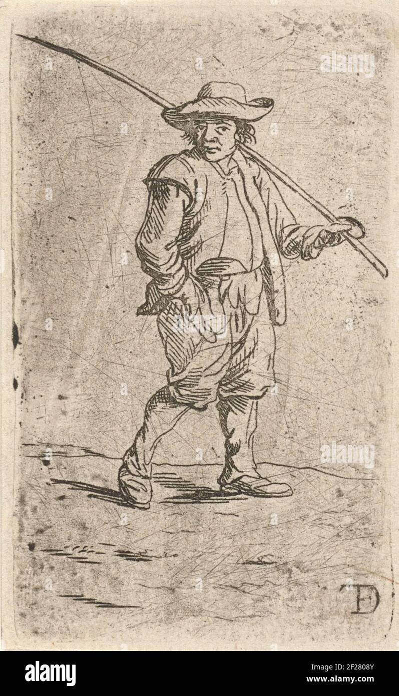 Man with a rod on his shoulder Stock Photo - Alamy