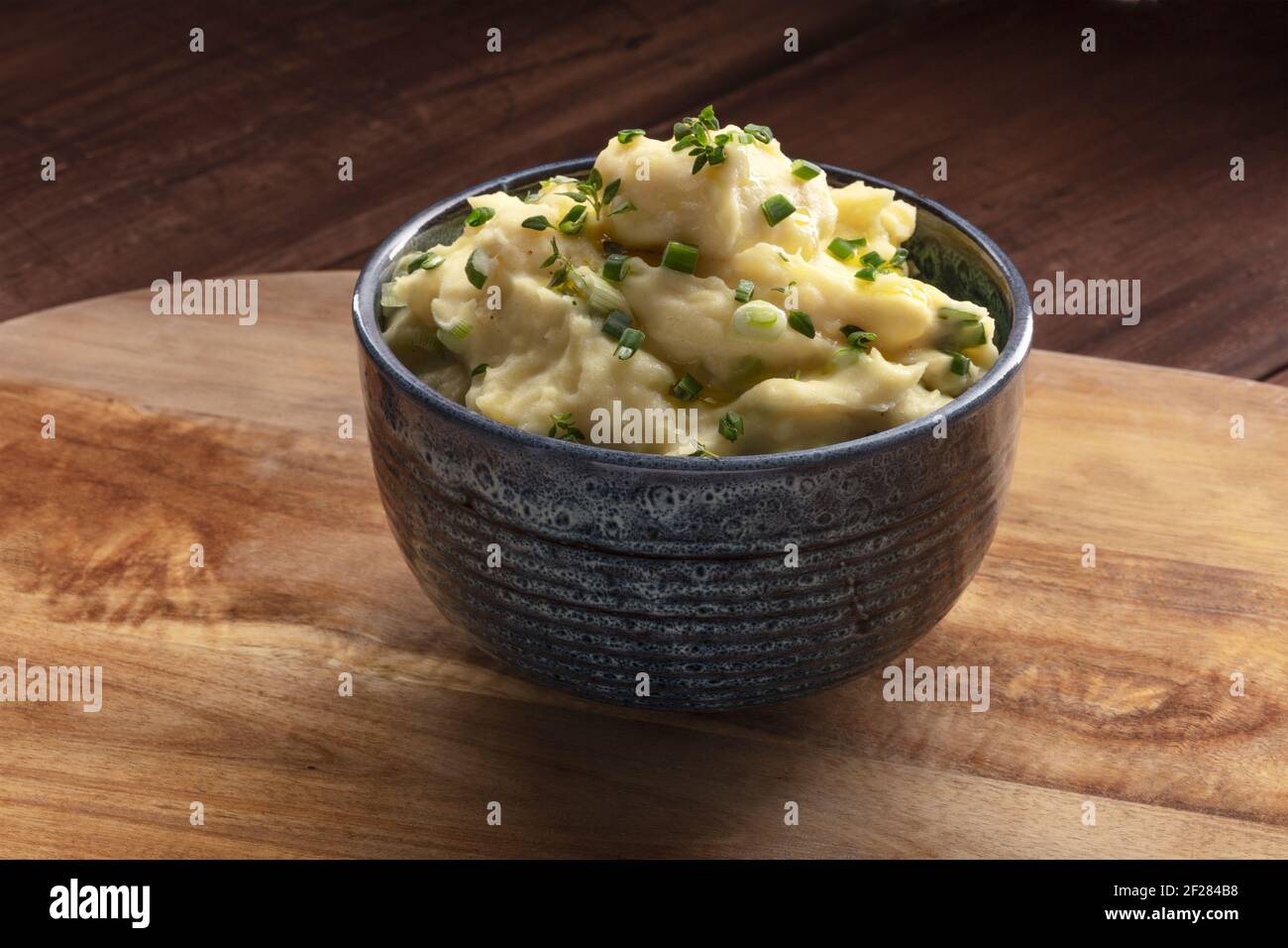 Pomme puree, a photo of a bowl of mashed potatoes with herbs on a ...