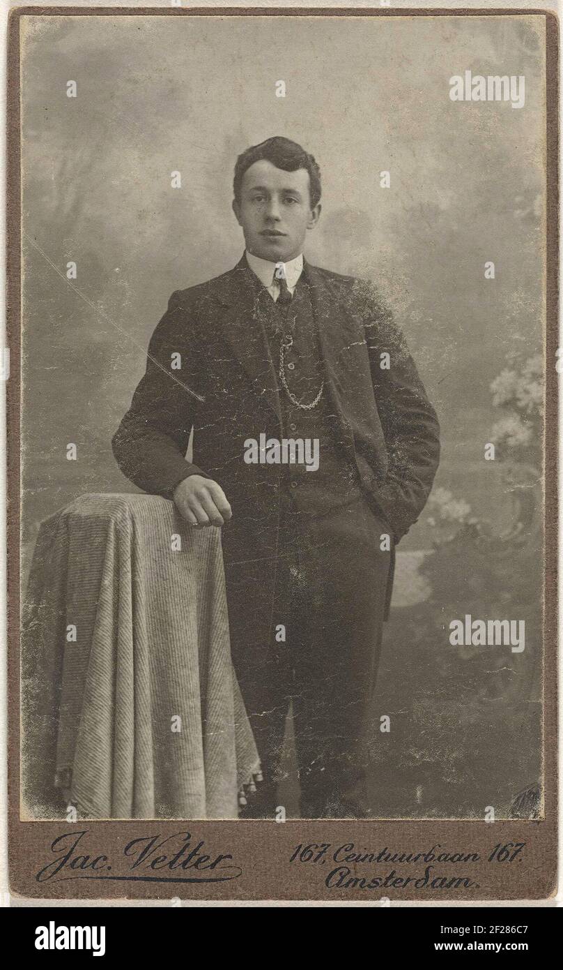 Studio portrait of a young man standing Stock Photo - Alamy
