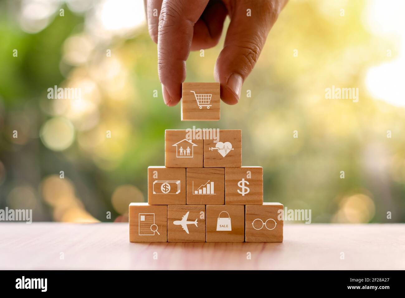Hand-sorted wooden blocks with merchandise symbols, online trading ...