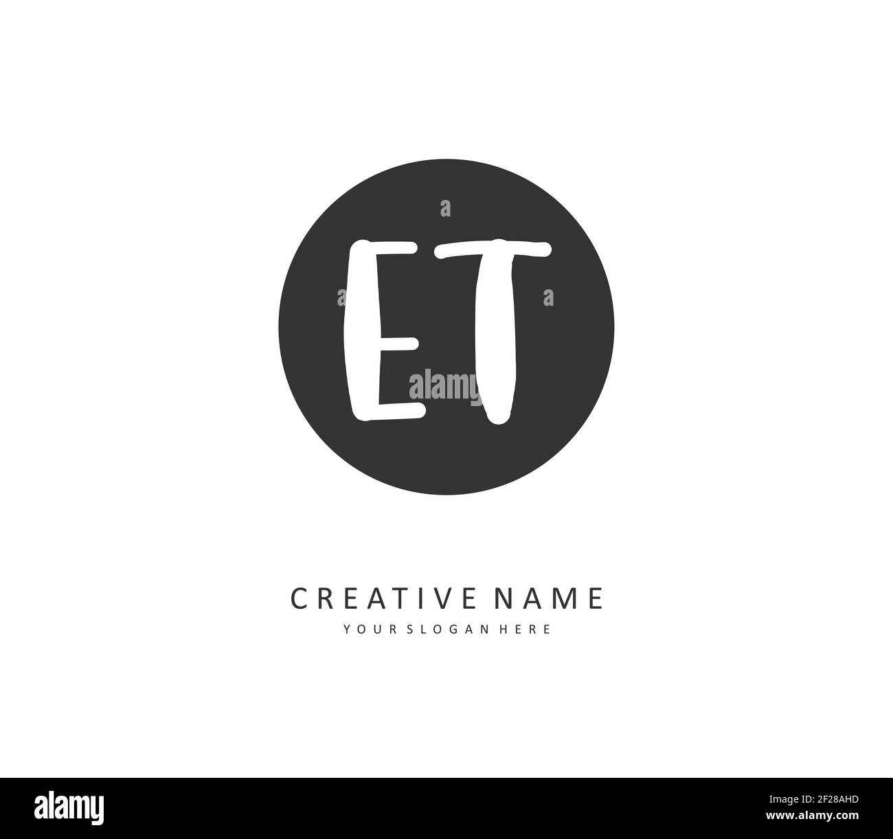 E T ET Initial letter handwriting and signature logo. A concept ...