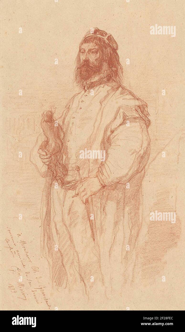 Standing man with figurine Stock Photo - Alamy