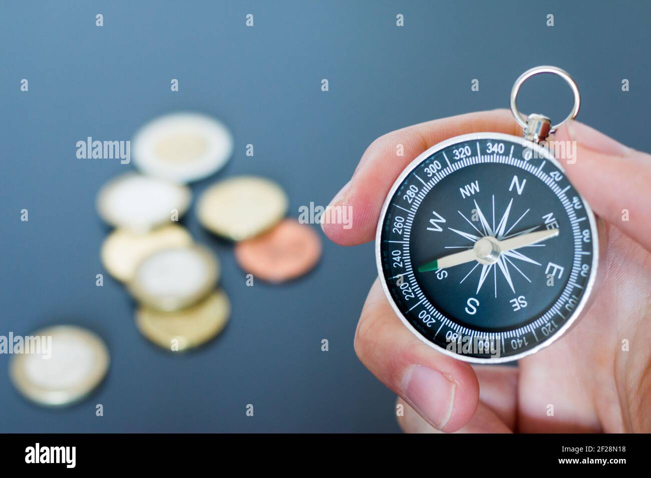 Innovation concept: Man is holding a compass in his hand, closeup ...