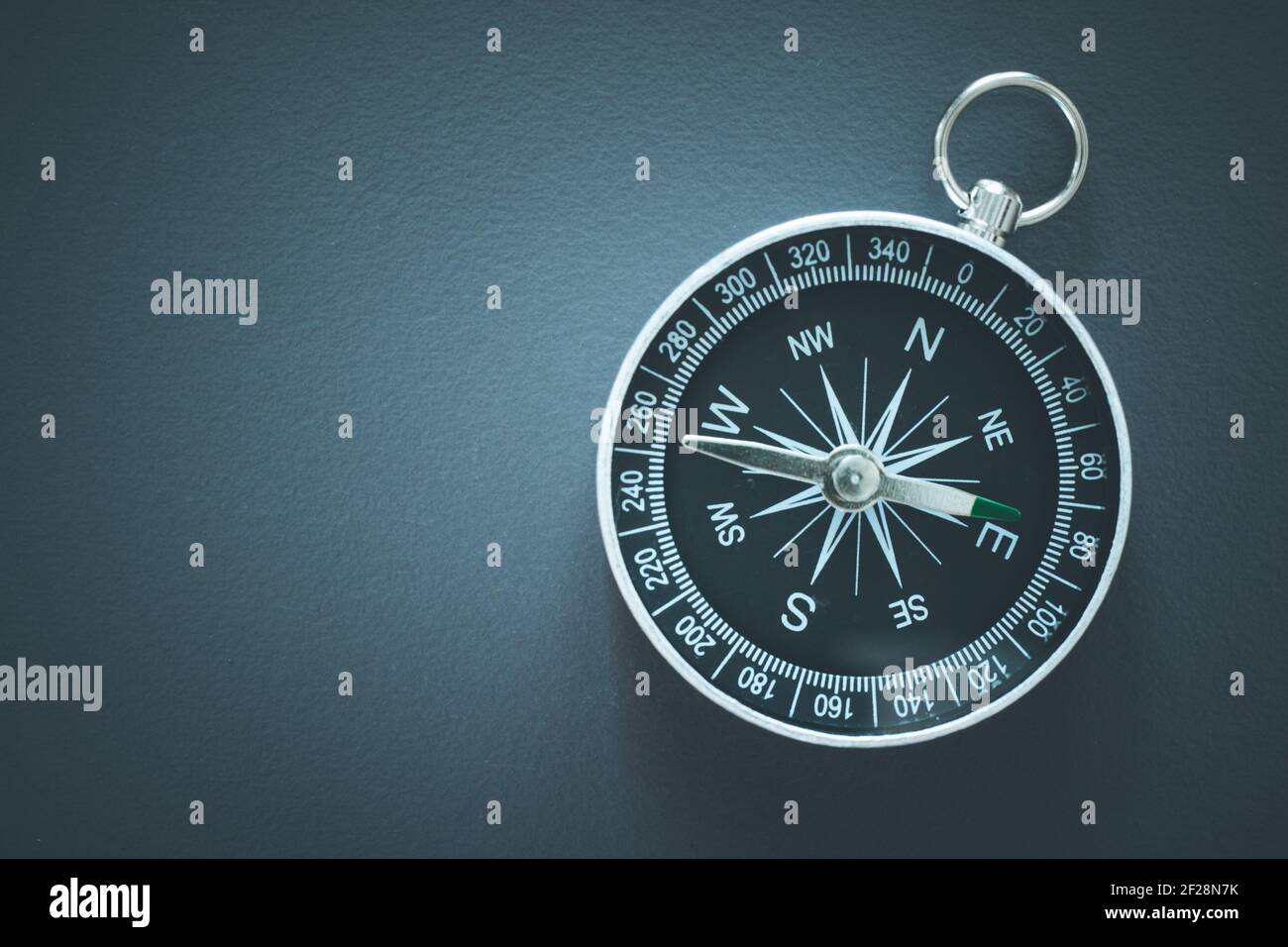 Compass lying on a blue office desk. Concept for business and ...