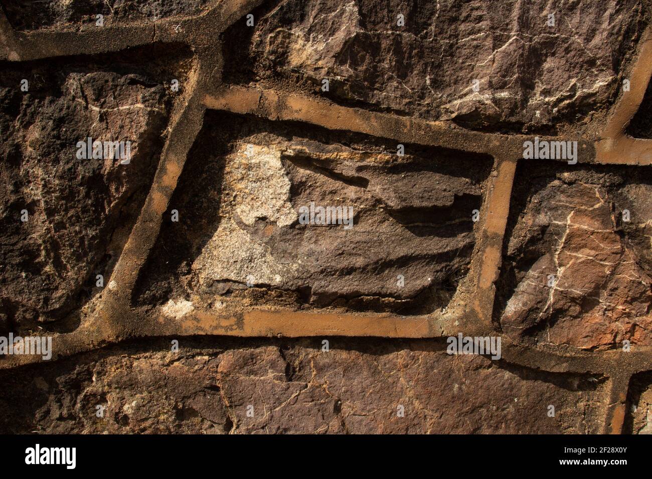 pale yellow raised pointing used between stone construction of building ...