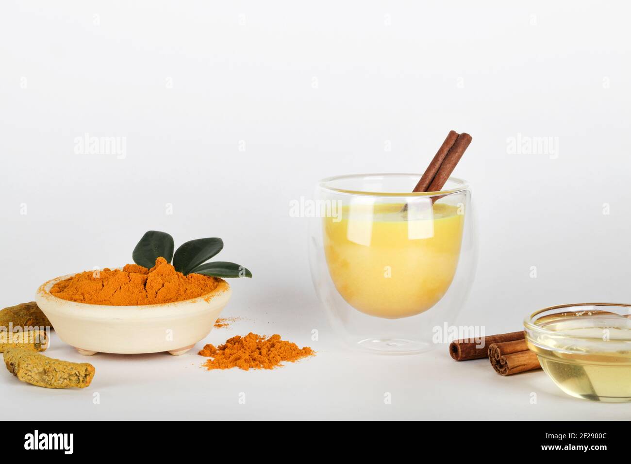 Hot healthy drink. Turmeric, golden milk with turmeric root, powder ...