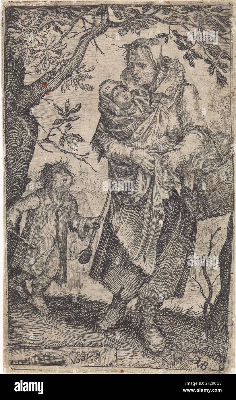 Beggar with two children Stock Photo - Alamy