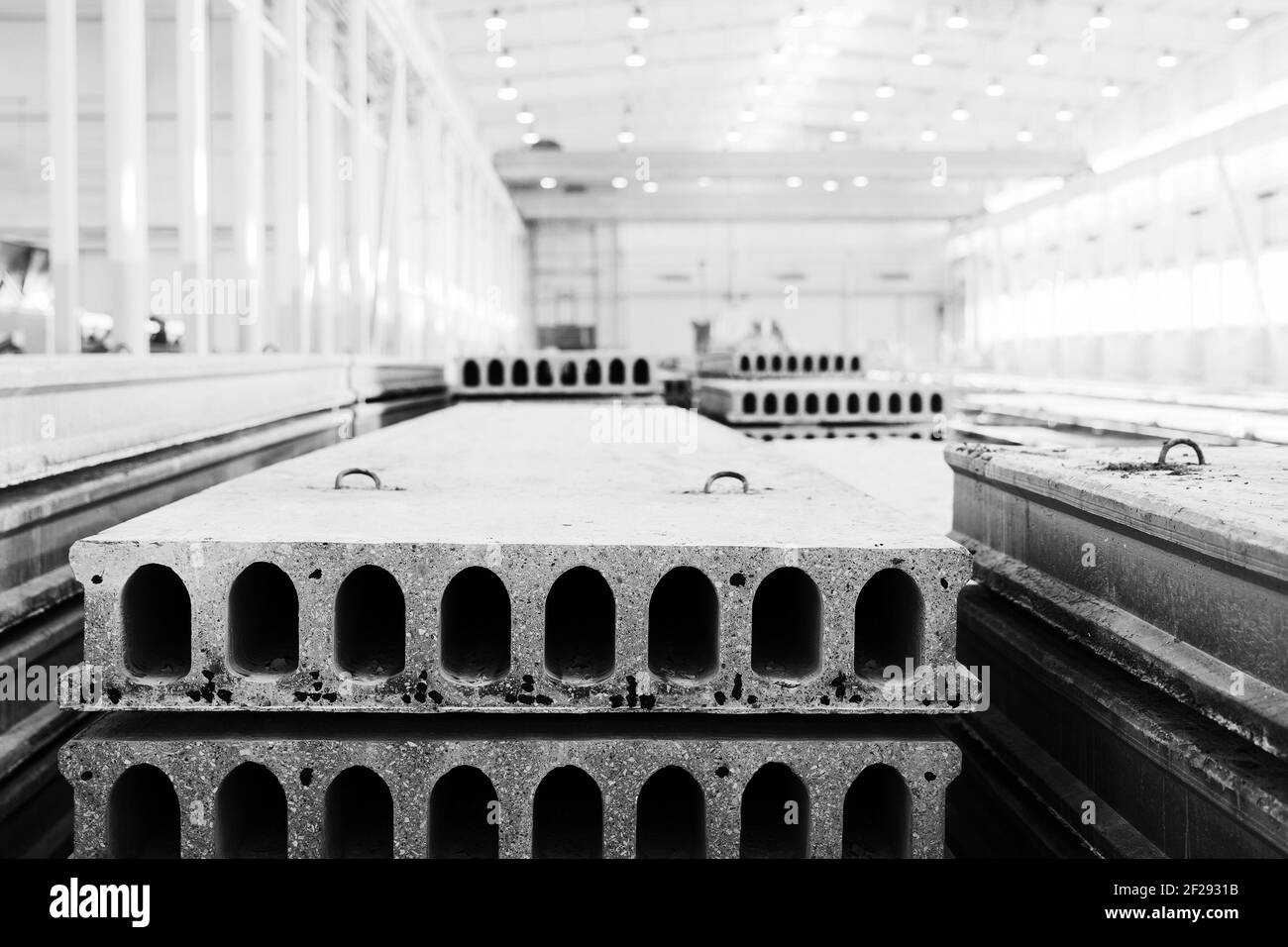 Stack of precast reinforced concrete slabs in a house-building factory ...