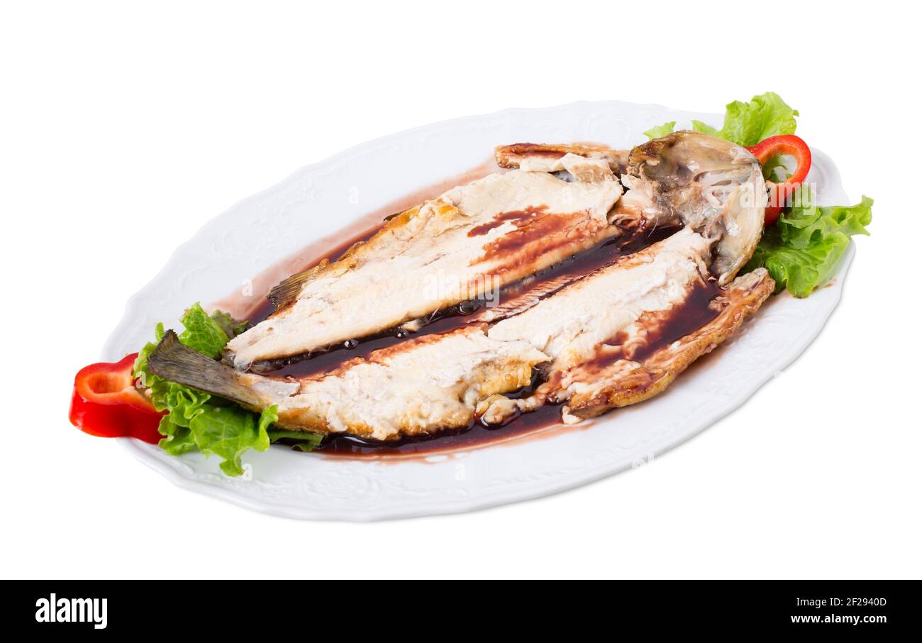 Grilled trout fillet with fresh vegetables. Isolated on a white ...