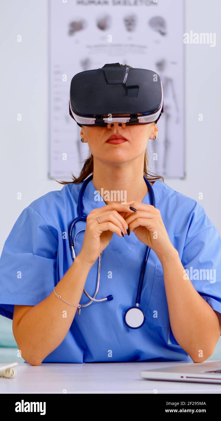 Health physician using medical inovation wearing virtual reality ...