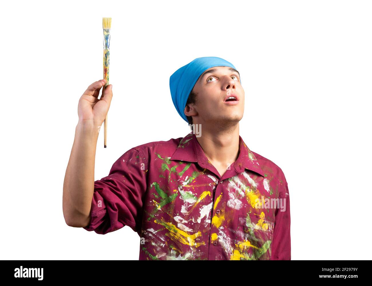 Smiling young painter artist pointing upwards Stock Photo - Alamy